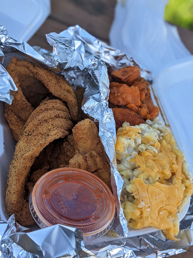 Fried fish with mac and cheese that doesn't just satisfy hunger—it creates memories. The kind you'll reminisce about during future salad lunches.