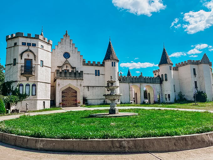 The castle's elegant facade with its ornate turrets and circular fountain creates a perfect backdrop for "I can't believe this is Missouri" moments.