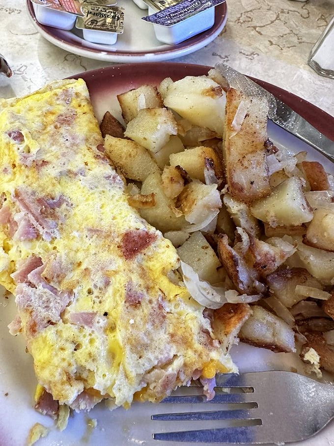 The ham and cheese omelet with home fries&mdash;proof that breakfast perfection doesn't require truffle oil or a 45-minute wait surrounded by people taking photos of their food.