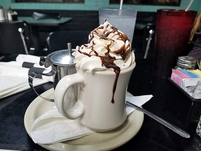 This isn't just hot chocolate&mdash;it's a tower of whipped cream drizzled with chocolate that makes Swiss miss the point entirely.