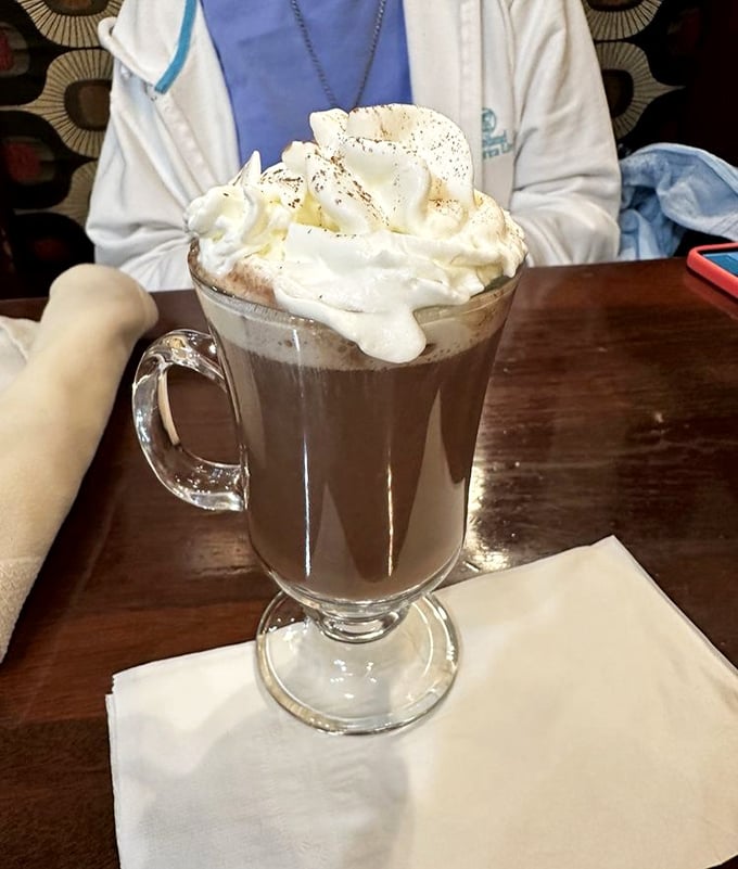 Hot chocolate that wears a cloud of whipped cream like a jaunty hat. This isn't a beverage&mdash;it's a warm hug in a glass.