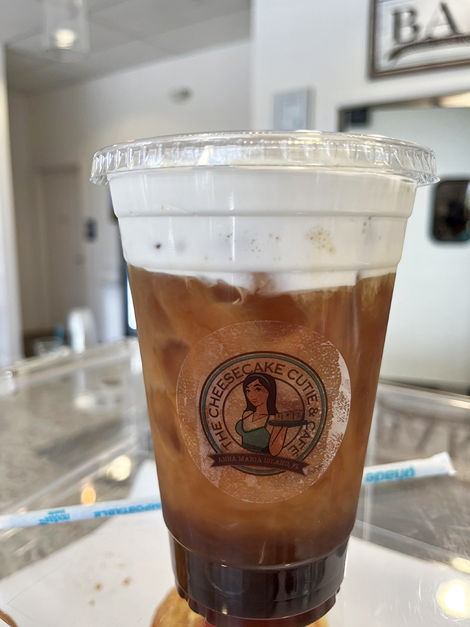 This isn't just iced coffee; it's summer in a cup, wearing the caf&eacute;'s logo like a badge of honor for serious refreshment seekers.
