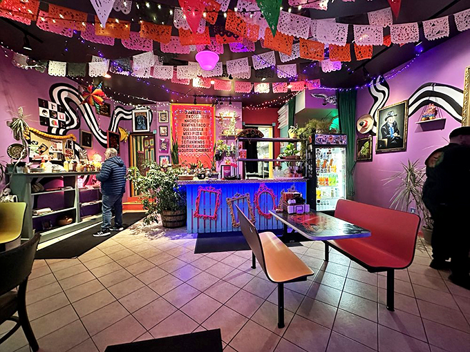 The dining room feels like the inside of a pi&ntilde;ata &ndash; in the best possible way. Papel picado banners, string lights, and vibrant colors create a perpetual celebration.