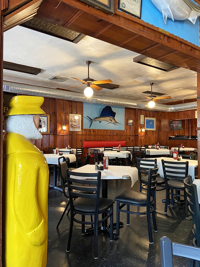 Red vinyl booths, wood paneling, and mounted sailfish&mdash;the holy trinity of authentic crab house decor. No Instagram filter required.