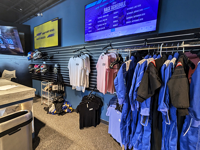 The gear wall – where racing dreams and safety requirements meet. That blue racing suit might not make you faster, but you'll look the part.