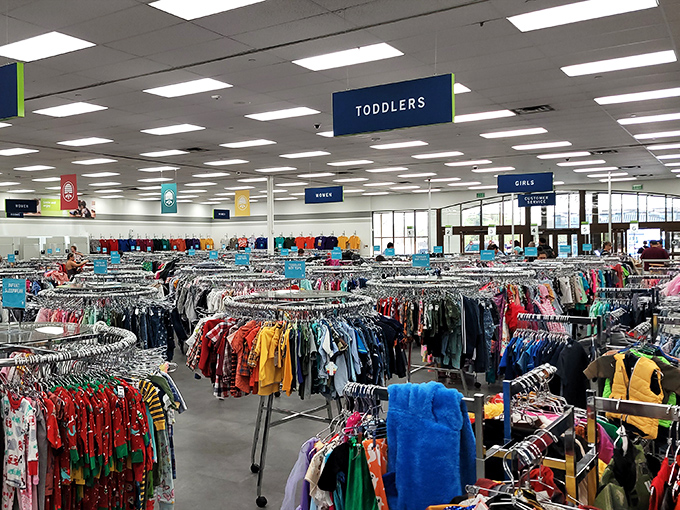 The children's section: organized by size and bursting with potential. Because kids outgrow clothes faster than Vegas changes its skyline.