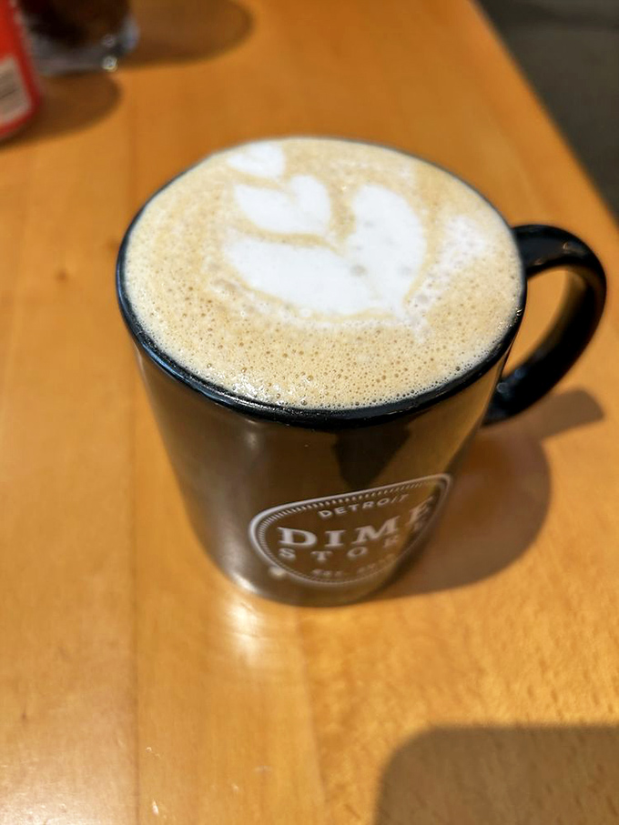 The latte art is almost too pretty to drink. Almost. That leaf design is the barista equivalent of a Picasso, but with the added benefit of caffeine.
