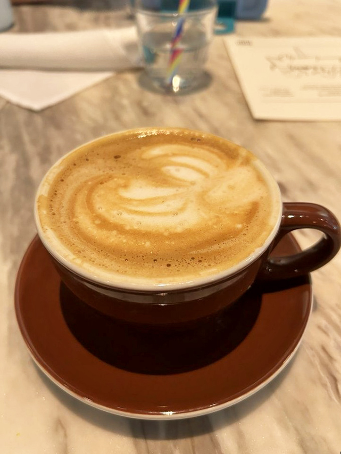Coffee art so pretty you almost don't want to drink it. Almost. That rich brown cup promises the perfect companion to whatever you order.