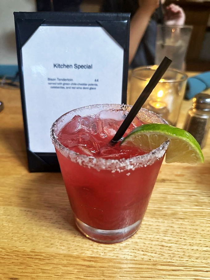 The prickly pear margarita—where the desert blooms in liquid form, rimmed with salt and promising the kind of evening stories are made of.