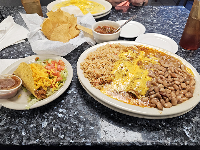 In Texas, enchiladas aren't just food—they're cultural ambassadors draped in melted cheese and surrounded by beans that have clearly been simmering since dawn.