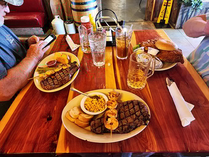 A table that tells the story of American abundance&mdash;multiple steaks, sides, and tall glasses of iced tea. This is how we feast in Missouri.