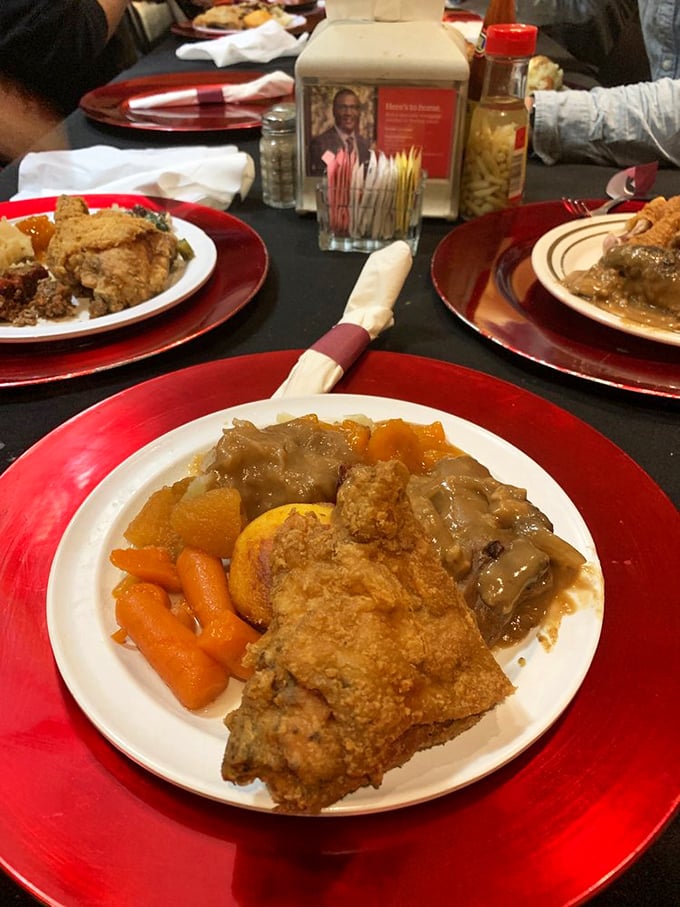 Comfort food democracy in action&mdash;where meatloaf, fried chicken, and gravy-smothered goodness coexist peacefully on red chargers of joy.