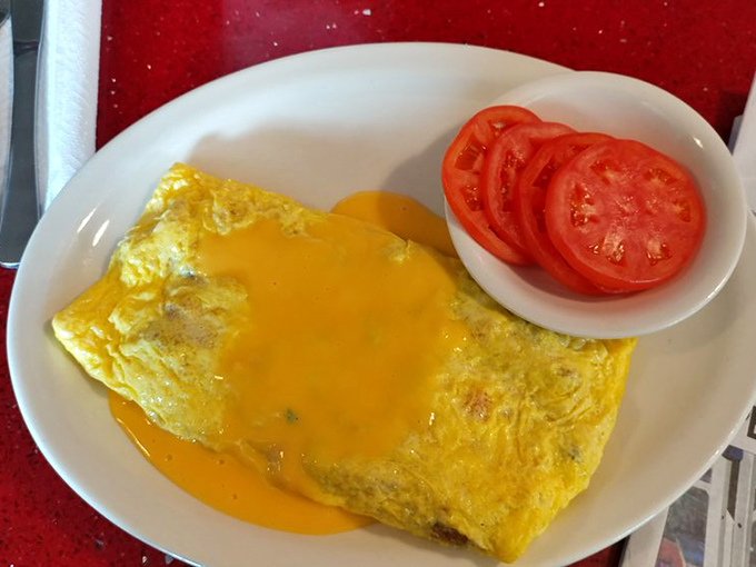 This isn't just an omelet &ndash; it's a golden envelope delivering a cheese-filled love letter to your taste buds.