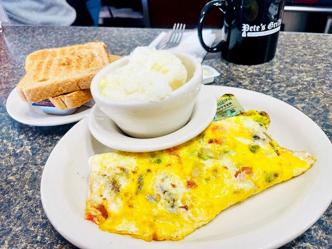 This isn't just an omelet&mdash;it's a yellow canvas of possibility, filled with melty cheese and served with grits that would make a Southerner nod approvingly.