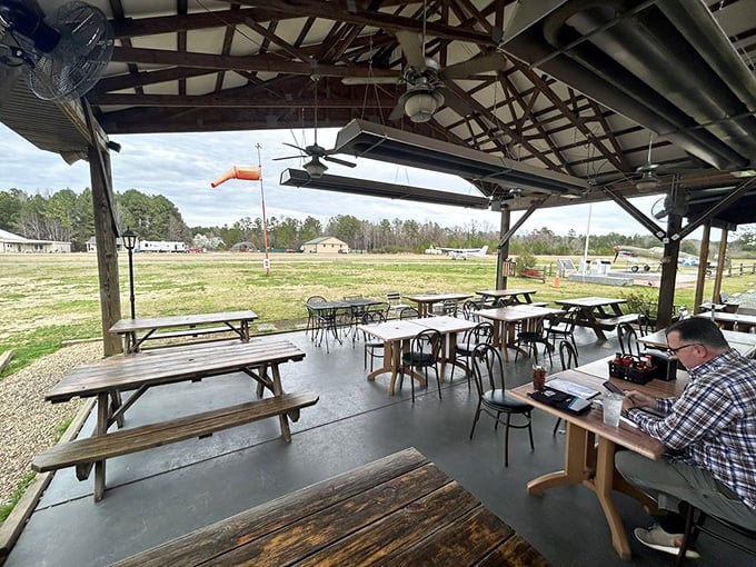Outdoor dining with runway views&mdash;the only place where "plane food" is actually something to get excited about.