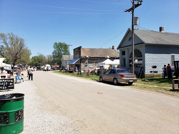 The heart of small-town America beats along this dusty path, where historic buildings frame a marketplace that's been bringing people together for generations.