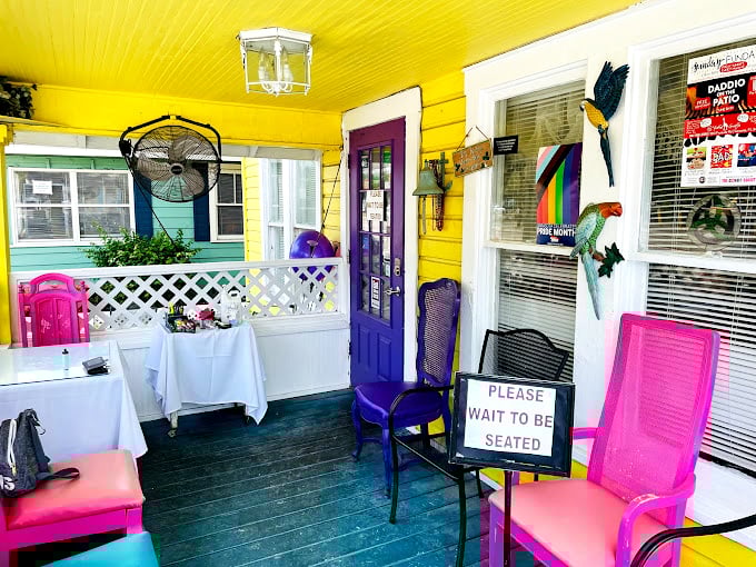 The porch at The Breakfast House feels like the Florida version of your favorite aunt's place&mdash;if your aunt were exceptionally stylish and loved purple doors.