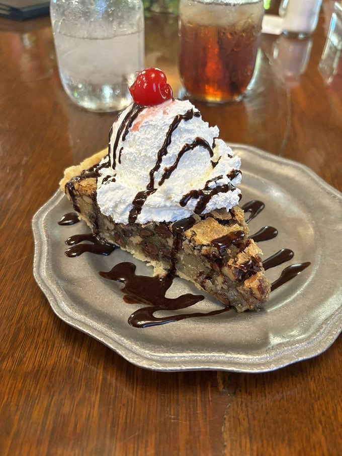 Pecan chocolate chip pie drizzled with chocolate sauce&mdash;because sometimes subtlety needs to take a back seat to pure, unadulterated pleasure.