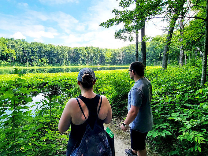 Hiking companions pause to absorb the view, proving that sometimes the best conversations happen without saying a word.