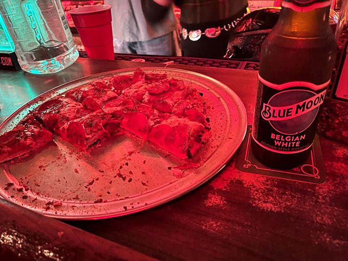 Even the pizza looks punk rock under these lights, paired perfectly with a Blue Moon after your third encore.