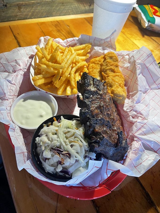 Ribs and chicken tenders with golden fries&mdash;proof that sometimes the best culinary experiences come in unpretentious black plastic containers.