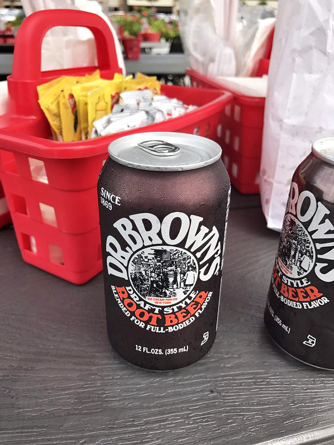 Dr. Brown's root beer—the perfect sidekick to any hot dog adventure. This dark, fizzy companion cuts through the richness like a carbonated superhero.