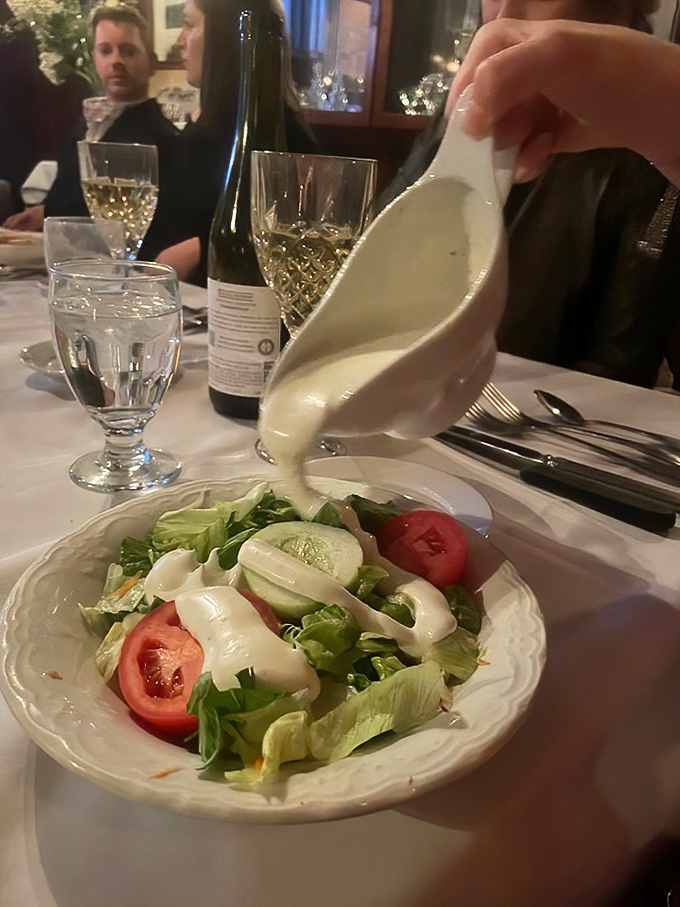 The house salad gets the royal treatment with a tableside dressing pour. Even the vegetables dress up for dinner at Pat's.