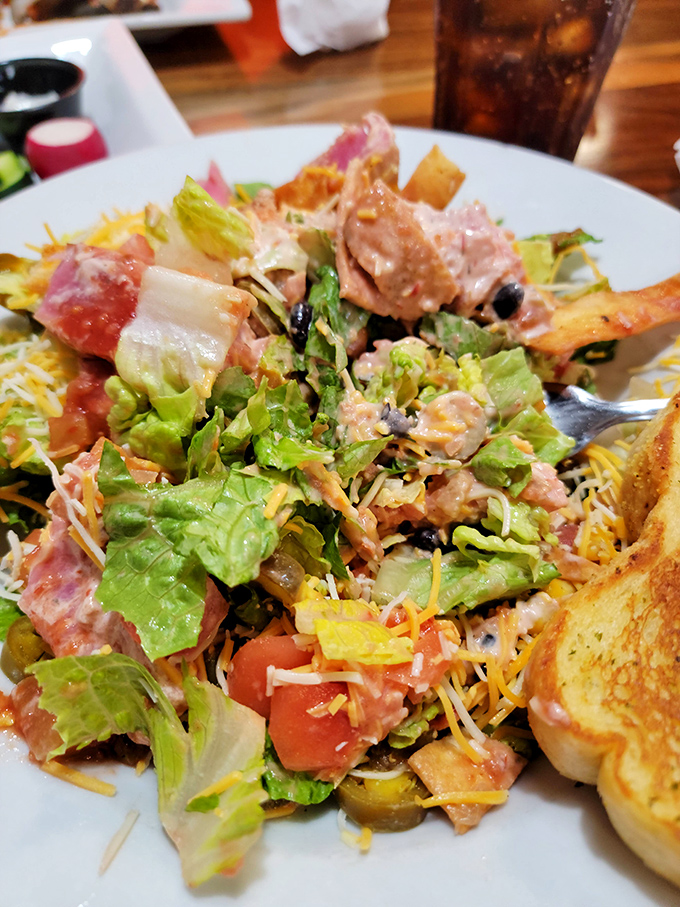 A salad that actually deserves respect &ndash; loaded with enough toppings to make you temporarily forget you came for steak. Almost.