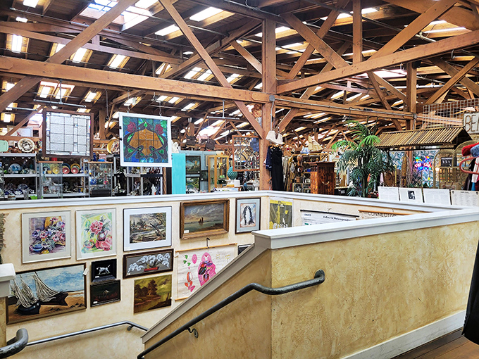 Art lines the stairway like breadcrumbs leading deeper into the labyrinth. That handrail has guided thousands of treasure hunters to unexpected discoveries.