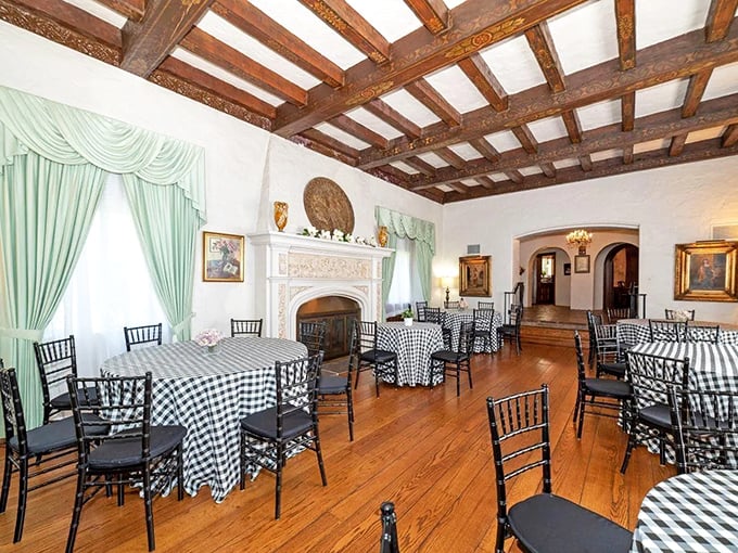 Black and white checkered tablecloths meet exposed wooden beams in this elegant space where medieval meets modern hospitality.