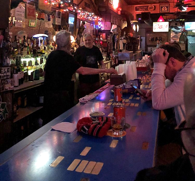 The unsung heroes of hospitality hold court, orchestrating the nightly symphony of pours, stories, and neighborhood connections.