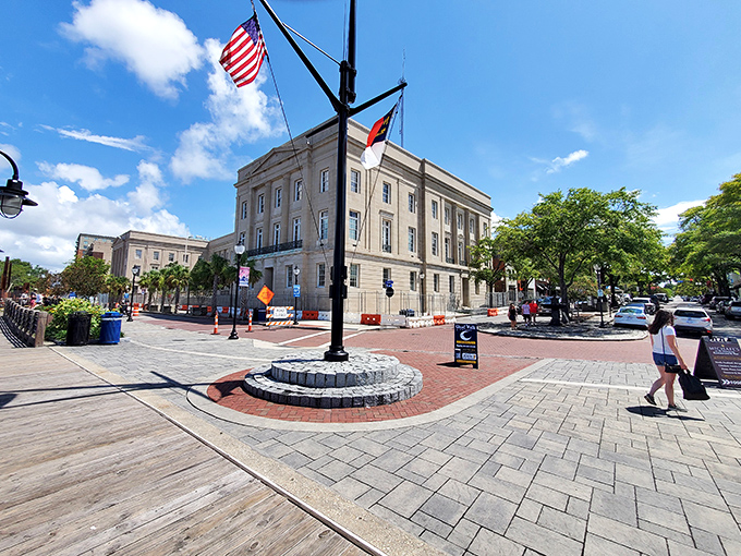 The heart of downtown Wilmington pulses with history and charm, where brick-paved streets and American flags create postcard-perfect corners.