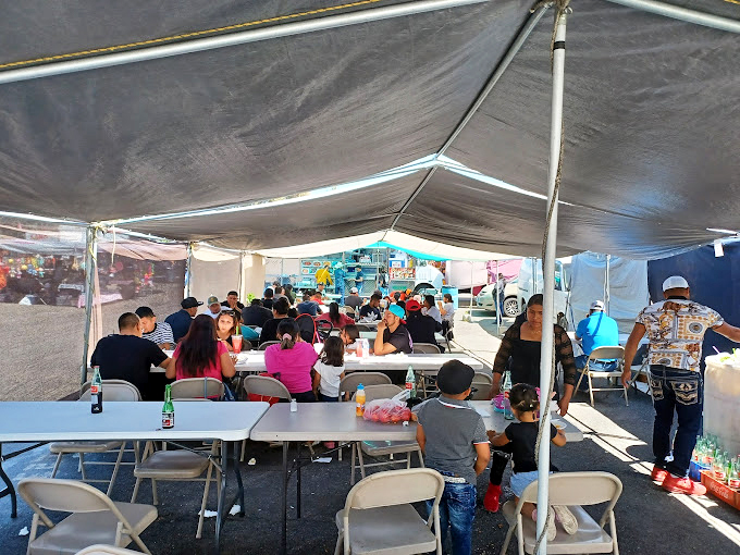 The communal dining room of the market, where strangers become temporary neighbors united by the universal language of good food.