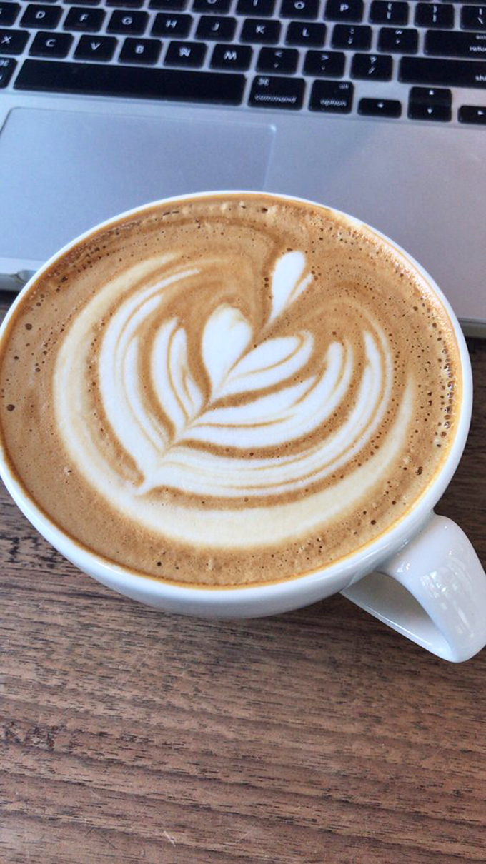 Latte art so beautiful you almost don't want to drink it. Almost. This leaf pattern floating on creamy espresso is Portland's liquid sunshine on a cloudy day.