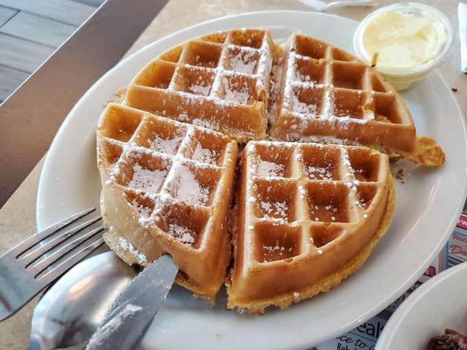 This waffle isn't just breakfast&mdash;it's an edible grid of happiness dusted with powdered sugar. The perfect canvas for maple syrup artistry.