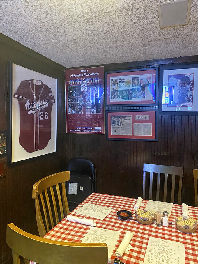 The wall of Razorback memorabilia tells stories of victories celebrated and defeats mourned&mdash;all over plates of Herman's legendary meat through changing decades.