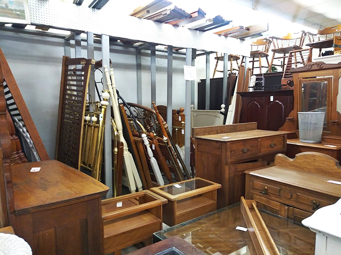 Bed frames and dressers stand at attention like wooden soldiers, each with stories of bedtime tales and sock drawers from generations past.