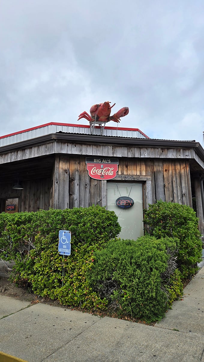That giant red crawfish on the roof isn't compensating for anything—the seafood inside is equally impressive.