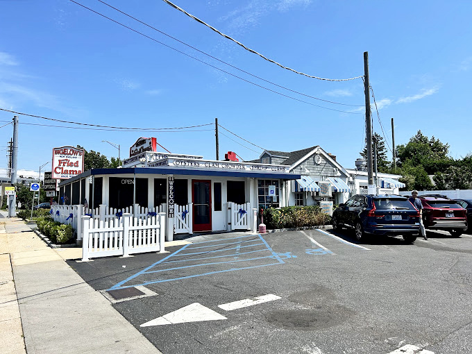 That classic white building with 'FRIED CLAMS' sign has been calling to hungry drivers since Roosevelt was president. Some things improve with age!