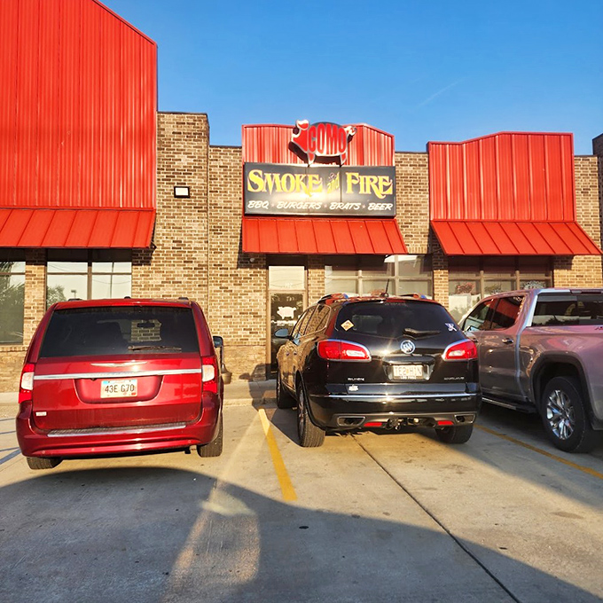 Como Smoke and Fire's vivid red awning signals flavor alerts to Columbia residents seeking serious barbecue satisfaction.

