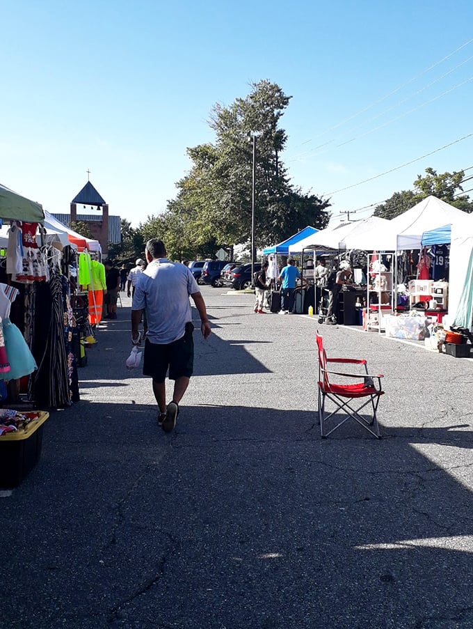 St. Mark's market creates ordered rows of possibility. That folding chair isn't just seating&mdash;it's a vendor's invitation to linger.