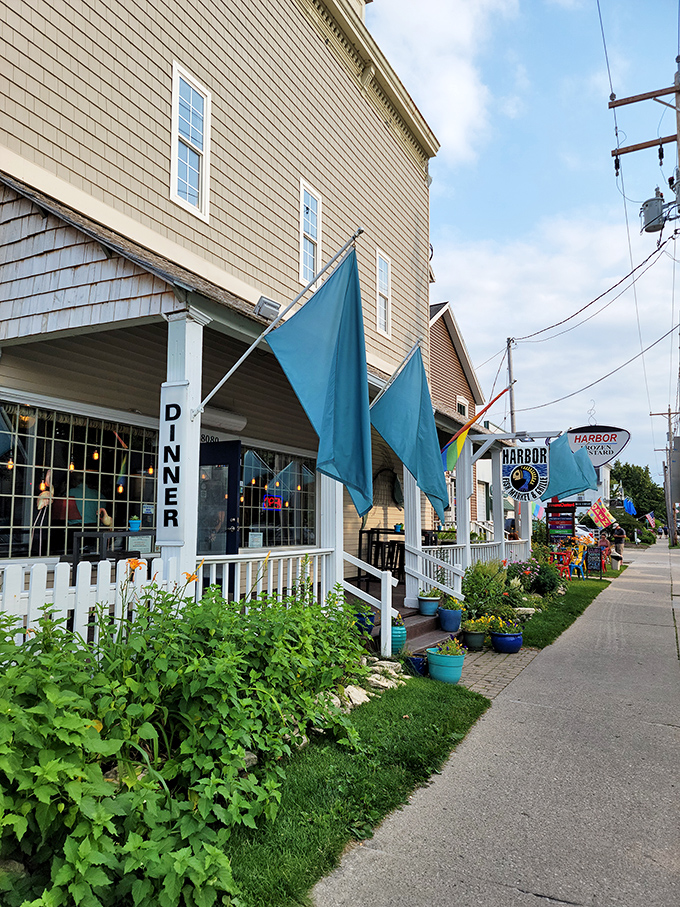 Harbor Fish Market streetview: Those cheerful blue flags and white porch railings practically shout "seafood served with a side of charm!" Door County magic.