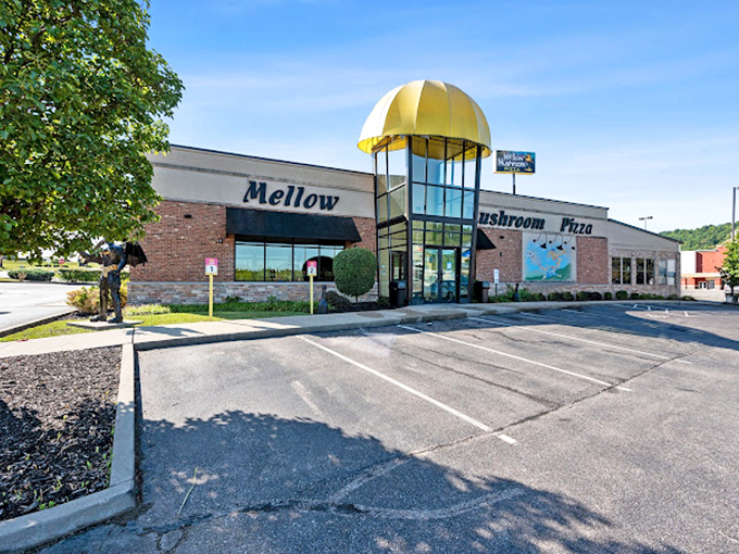 Mellow Mushroom's distinctive yellow cap entrance is the architectural equivalent of "Come hungry, leave happy."
