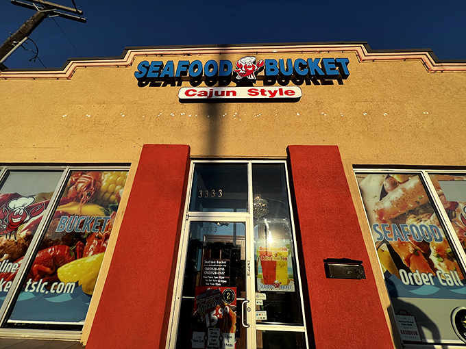 Seafood Bucket's vibrant sign promises a Cajun adventure that'll have you speaking with a Louisiana accent by dessert.
