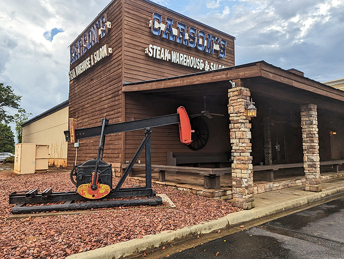 Sunset bathes Carson's in golden light, like nature's spotlight on a steak superstar. The wooden facade promises rustic perfection inside.