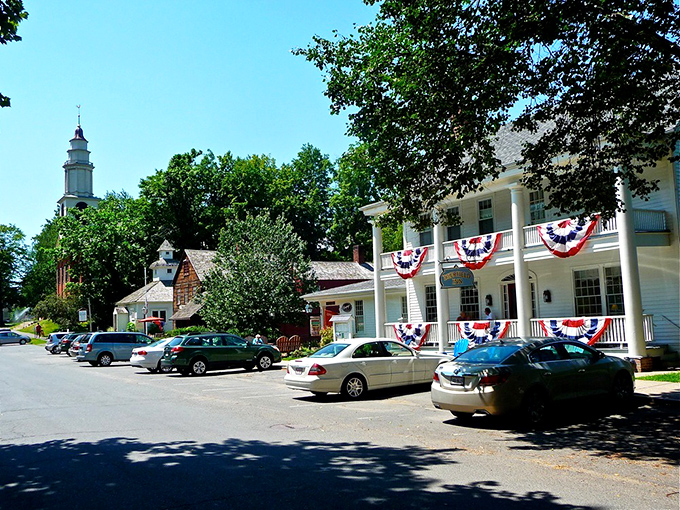 American flags flutter against Deerfield's pristine white buildings, a Norman Rockwell scene come gloriously to life.