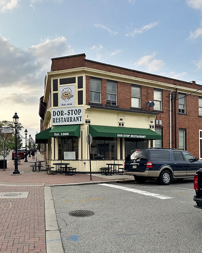 Those green awnings shelter a breakfast institution where pancakes achieve the perfect balance between "cloud-like" and "I can't believe I ate the whole thing."