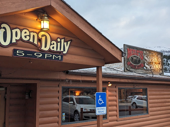 "Open Daily" – two beautiful words. Milt's wooden welcome and vintage sign hint at the prime rib perfection waiting inside.