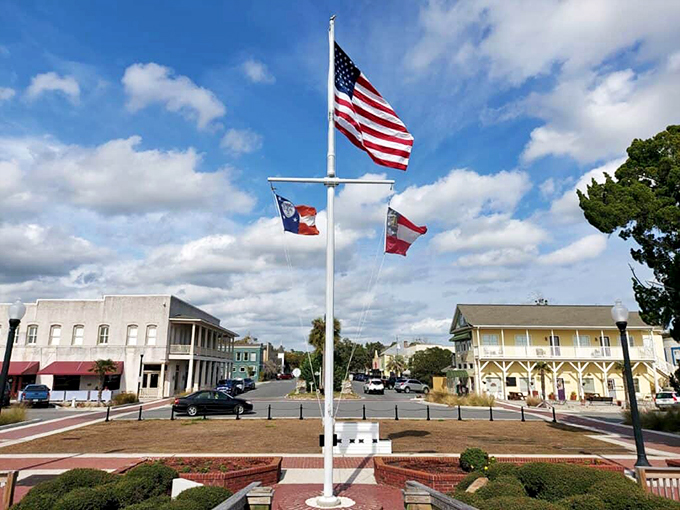 Where American flags flutter against coastal skies – St. Marys' waterfront serves small-town charm with a salty breeze chaser.