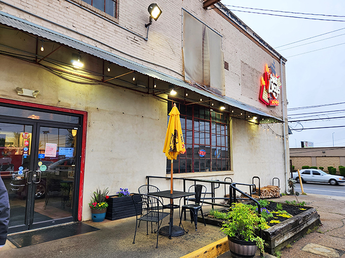 Sweet Lucy's Smokehouse: Yellow umbrellas brighten the concrete jungle, promising sunshine-worthy flavors within this urban smoke factory.